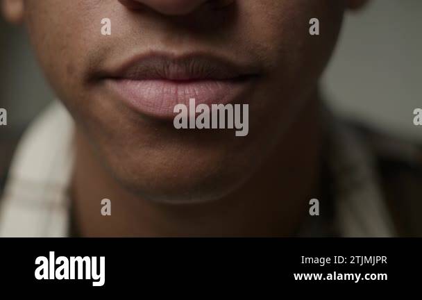 Black male mouth shows doubt, close up. African American mans face ...