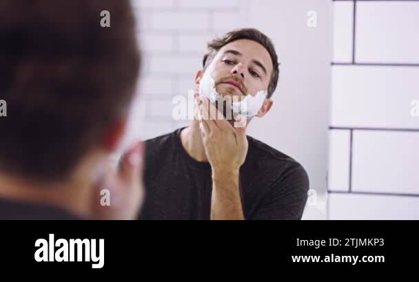 Man, face in mirror and shaving cream, hygiene and grooming with beauty ...
