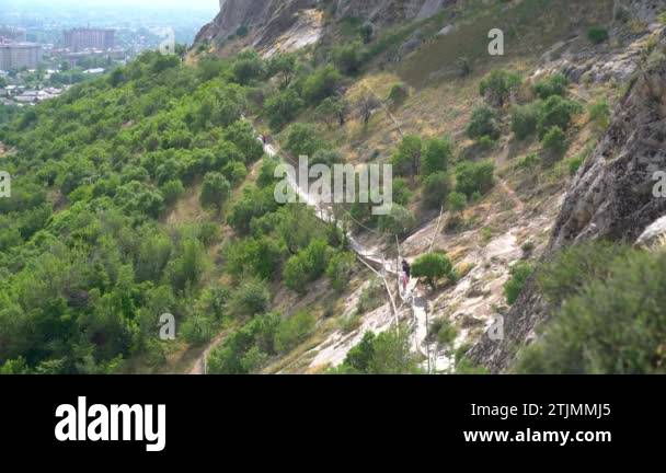 Osh, Kyrgyzstan - May 2022: Visitors in Sulaiman Too mountain to visit ...