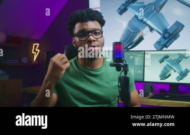 African American 3D designer speaks on camera using microphone, records ...