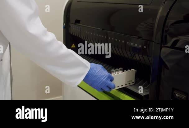 A blood test with computer equipment. Blood Testing Machine Checks ...