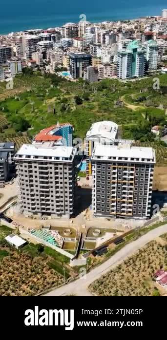 Witness the mesmerizing aerial perspective of a high-rise construction ...