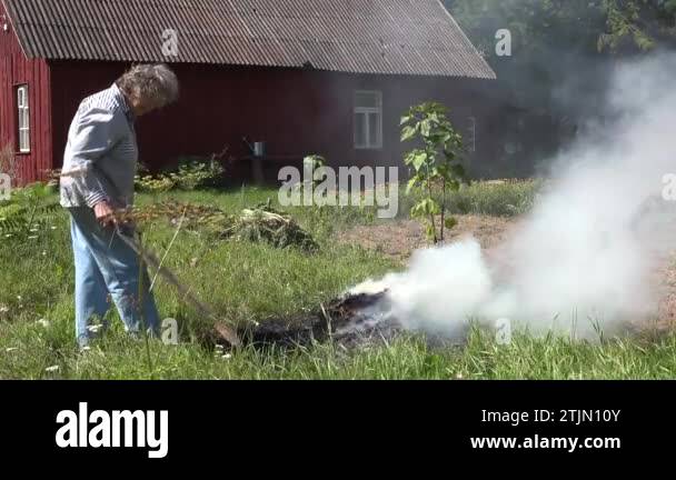 Villager burning fallen leaves Stock Videos & Footage - HD and 4K Video ...