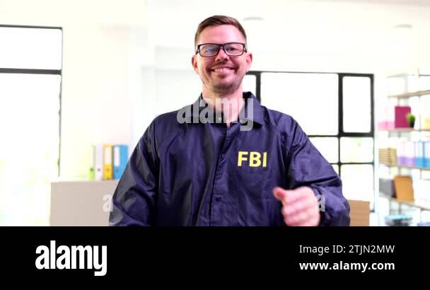 Man with glasses FBI officer crossing his arms portrait 4k movie. Work in federal bureau of ...