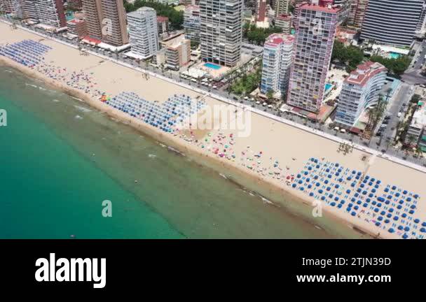 Aerial drone footage of the beautiful city of Benidorm in Spain in the ...