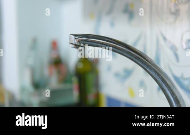 Tap Water dripping wastage,falling potable water drop,pure water ...