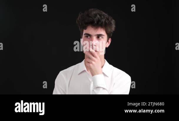 Busy Caucasian man On a black background fully engaged in his work or ...