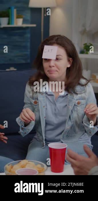 Vertical video: Group of multiethnic friends spending time together ...