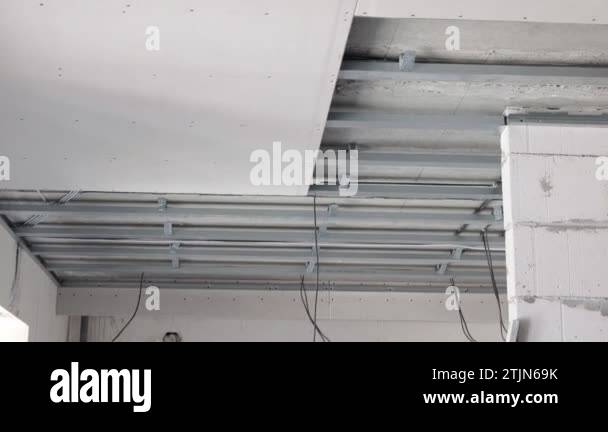 Structure with profiles and plasterboard for installation of suspended ...