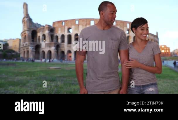 African-American male and female exploring Rome, Italy while on ...