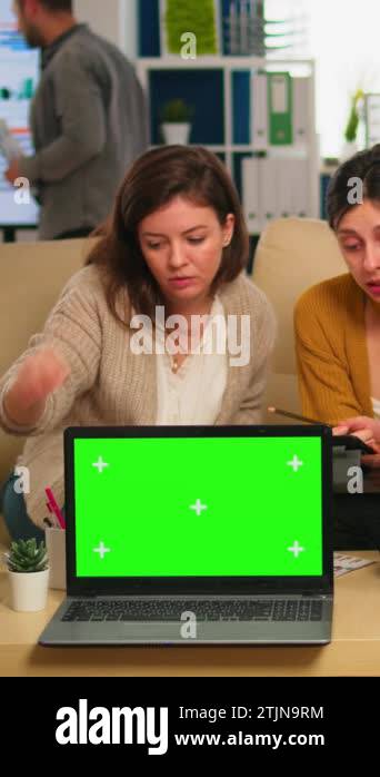 Diverse businesswomen analysing annual financial reports sitting on ...