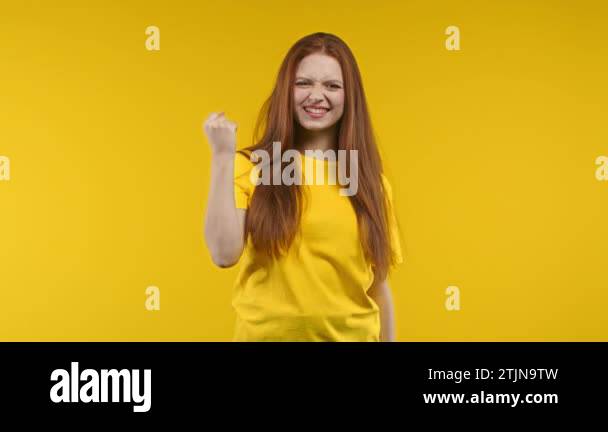 Pretty woman makes hand sign like, thumbs up gesture. Happy girl ...