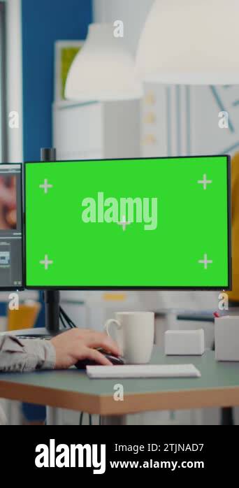 Videographer using computer with chroma key, mock up isolated display ...