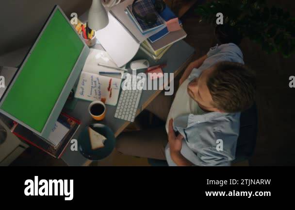 Relaxed guy stretching home workplace top view. Bearded man making ...