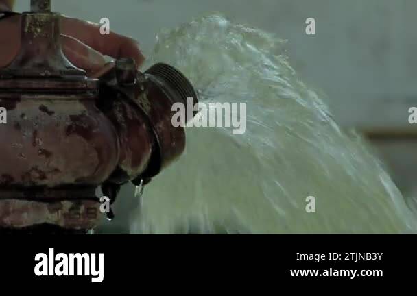 Inmate Drinking Water from an Old Hand Water Pump in the Yard of an ...
