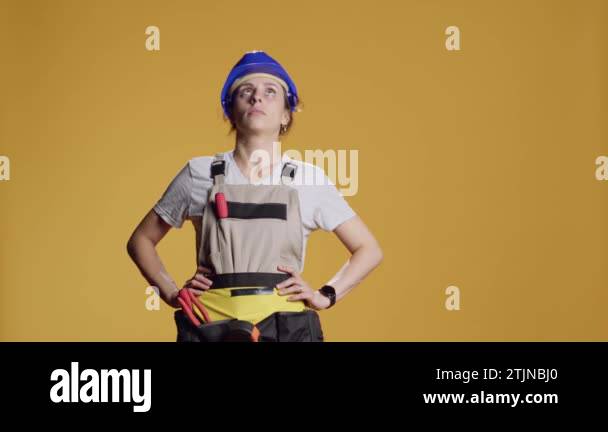 Portrait of female construction worker being dizzy and seeing ...