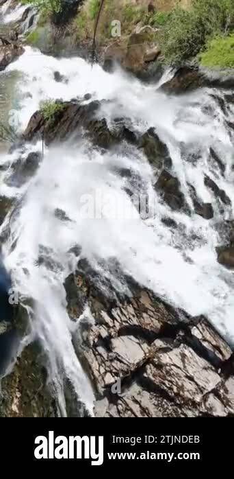 Witness the majestic beauty of a magical waterfall with azure water in ...