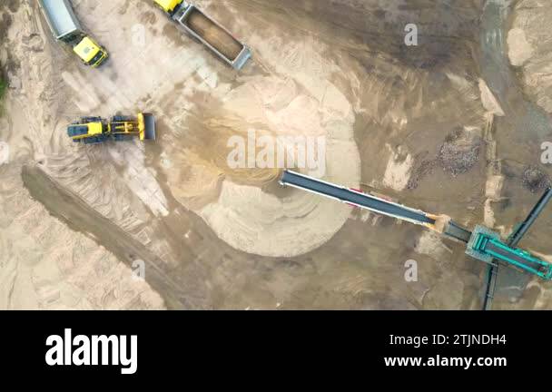 Wheel loader load sand in dump truck in open pit. Heavy machinery on ...