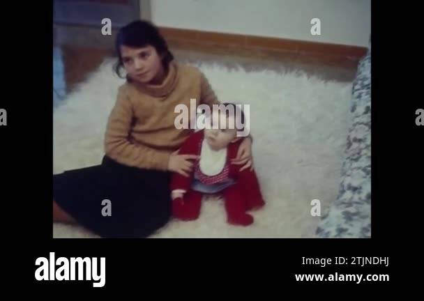 palermo, italy may 1970: two children boy and girl play at home in the 70s Stock Video Footage ...