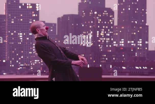 Clown funny mime behind an invisible glass box or wall pulling a rope ...