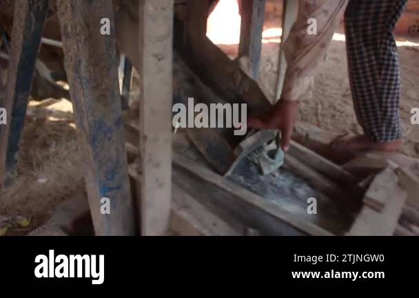 MCU old fashioned wooden rice processor in rural rice mill in Southeast ...