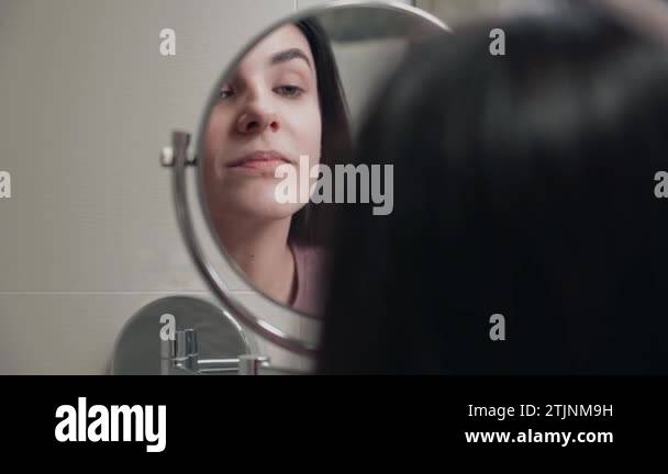 young woman takes care of her facial skin. Doing beauty treatments ...