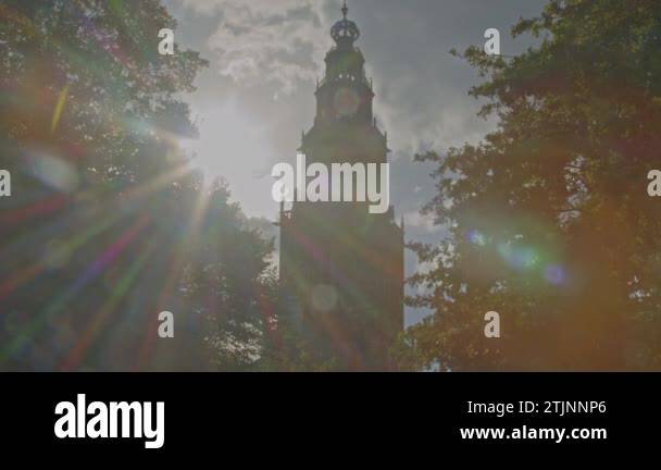 Tilt down of Martini tower with the sun flaring into camera.The ...