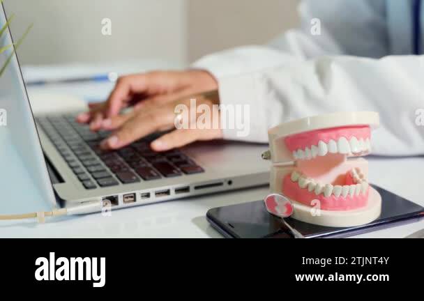 Dentist doctor or nurse in uniform use oral software teeth Xray and ...