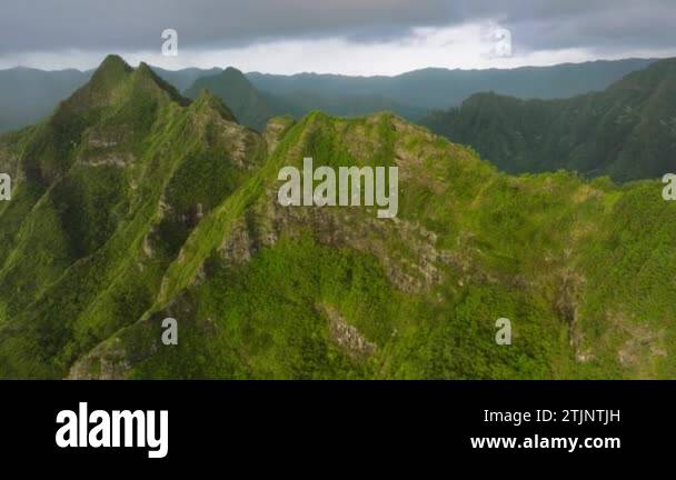 Incredible scenery of green and weird-shaped peaks over ocean coast ...