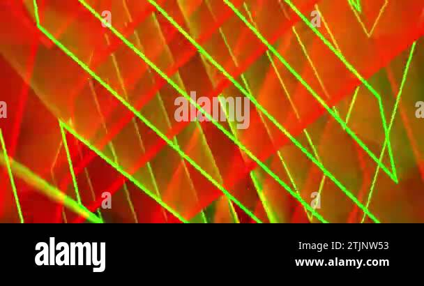 Red, yellow and green flashing light beams rotate in 3d on a dark ...