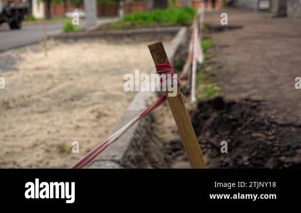 Red and white warning tape stretched Protection tape defining the ...