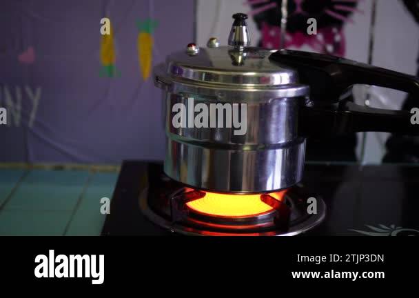 Video showing the operation of a pressure cooker on an electric gas ...