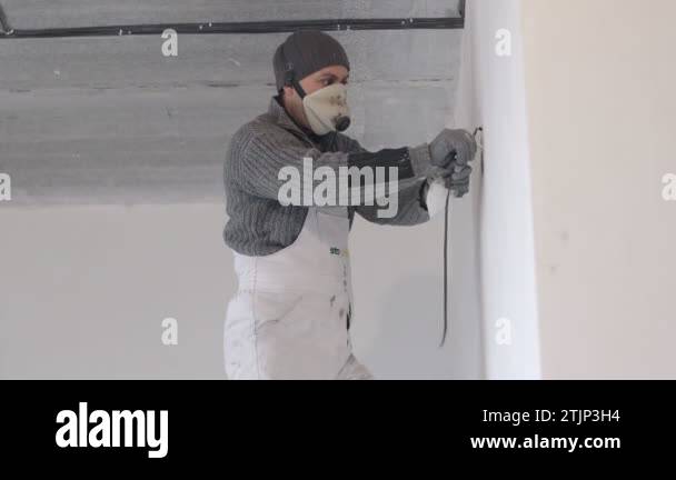 Electrician laying wiring cable, mounting electricity lines in the ...