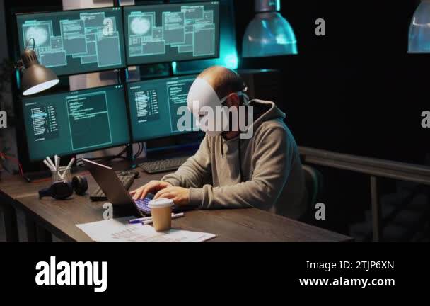 Cyber impostor wearing mask hacking database servers, hacker with hood breaking into computer ...