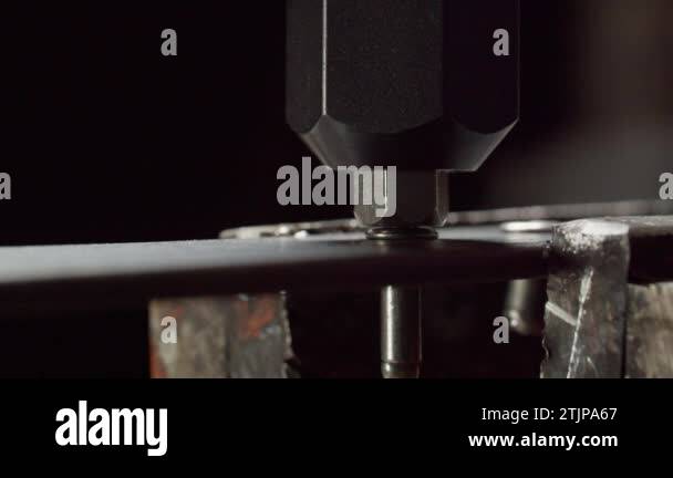 Process of metal rivet installing to connect details in plant workshop ...