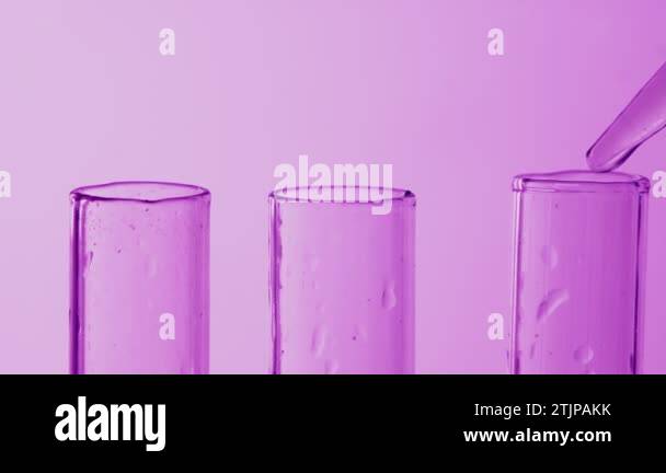 Drop from pipette drips into laboratory test tubes Stock Video Footage ...