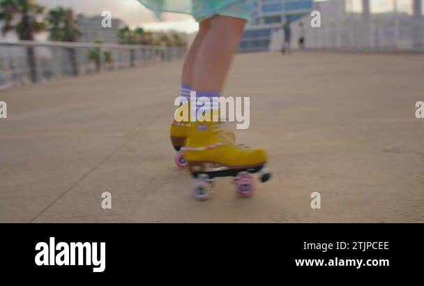 Female legs in retro funky roller skates smooth and effortless do ...