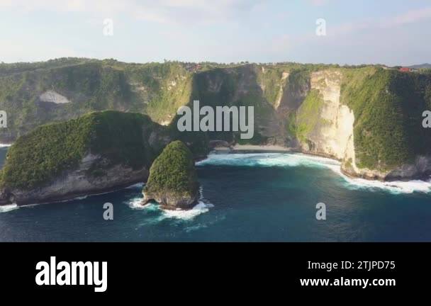 Dramatic aerial drone footage of the famous Kelingking beach, aka T Rex ...