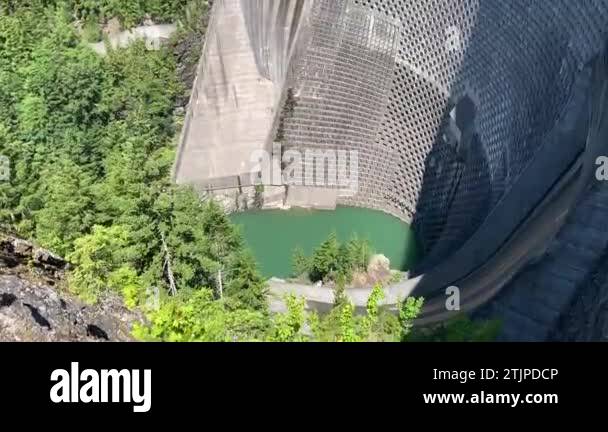 Tilt up view to show the scale of the massive Ross Dam at Ross Lake ...