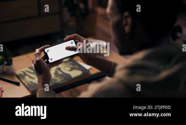 Content Creator African American content creator, holds a cellphone ...
