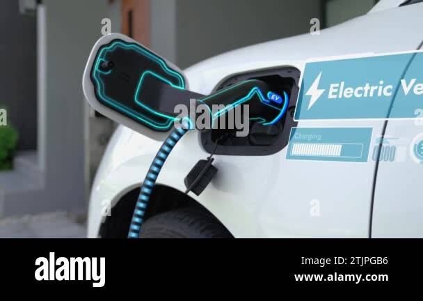 Electric car recharging in futuristic home charging station with smart digital EV battery status ...