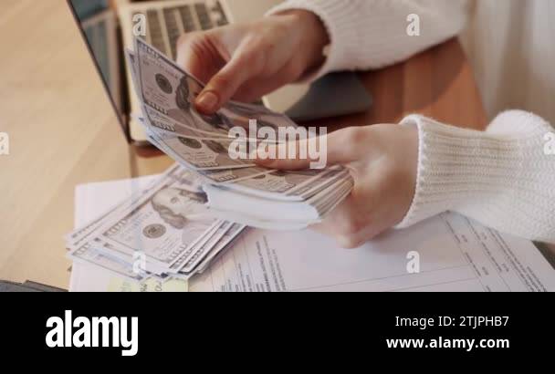 Corrupt money system. Stressed young woman calculating monthly home ...