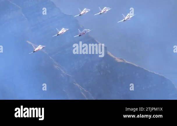 Acrobatic team of six fast jet airplanes in flight in narrow formation ...