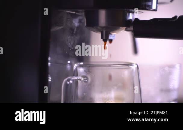 close-up of Coffee foam. espresso crema comes out of the fully ...