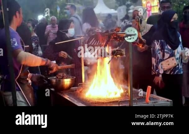 Gurney, Penang, Malaysia - Aug 28 2022: Hawker burn the mutton meat at ...