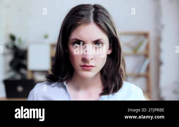 Young woman, employee feeling irritation and anger, putting on paper ...