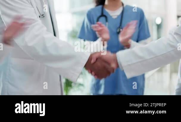 Doctors, handshake and partnership in medical hospital with team to celebrate collaboration or ...