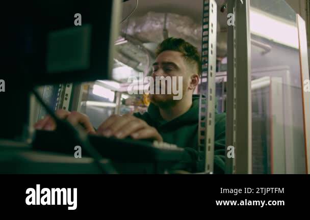 focused hacker data center hacking software system vulnerable cyber security server room ...