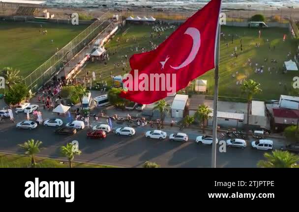 Young people holding hands up, relaxing at outdoor party, having fun ...