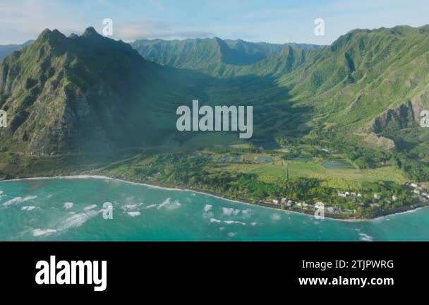 Aerial of dramatic mountains, blue ocean at Kualoa Ranch park ...